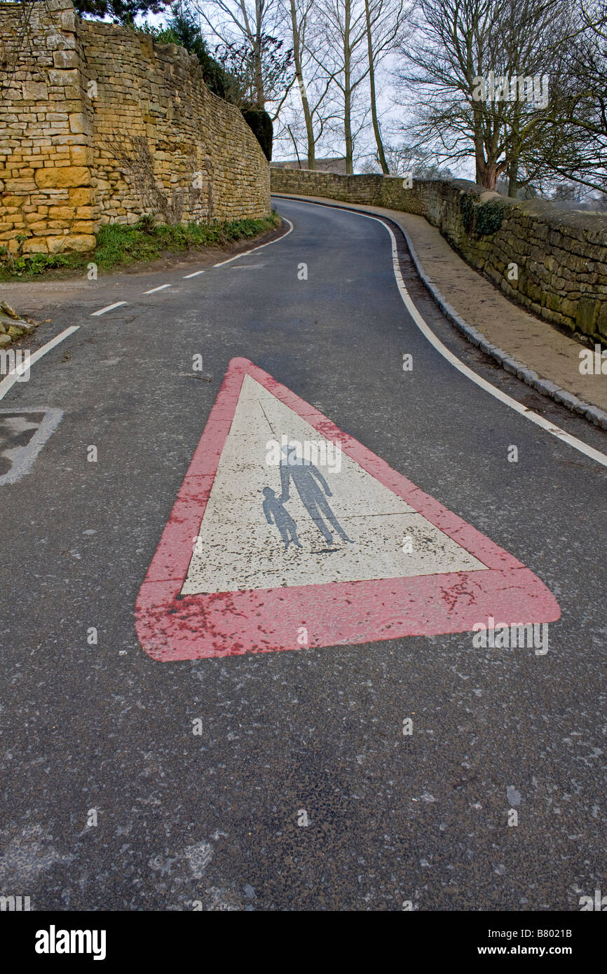 Pedestrian warning road sign on tarmac road UK Stock Photo - Alamy