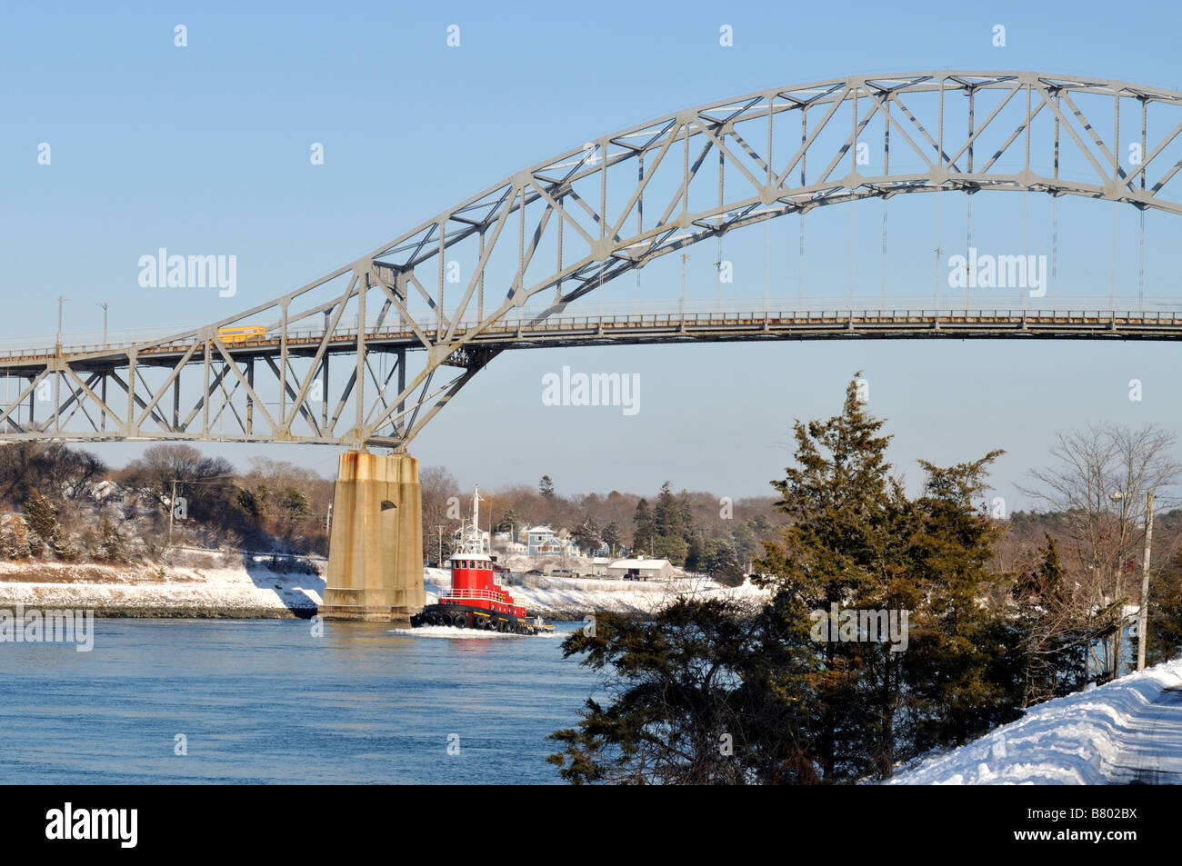 Tugboat navigating the Cape Cod Canal and passing beneath the Sagamore ...