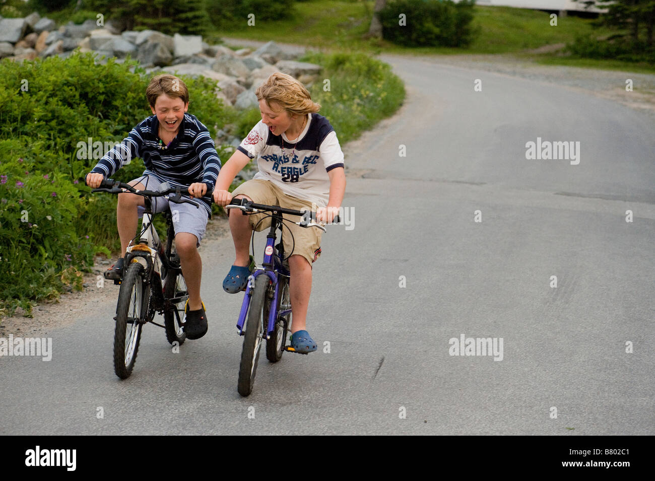 Kids riding their bikes together Stock Photo - Alamy