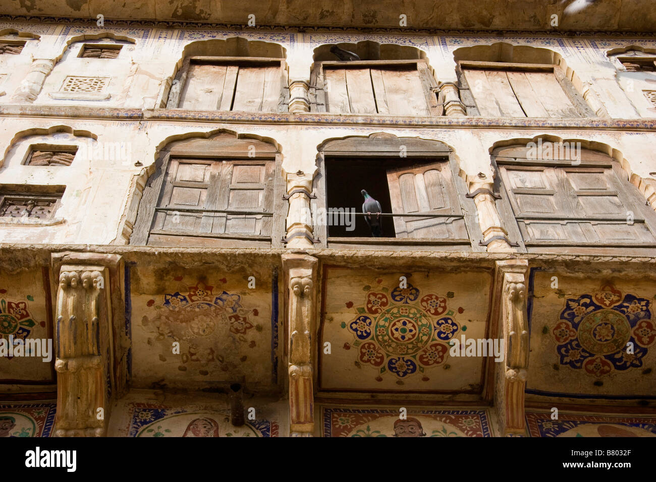 Pigeon sits on Haveli window sill Jhunjhunu Rajasthan India Stock Photo ...