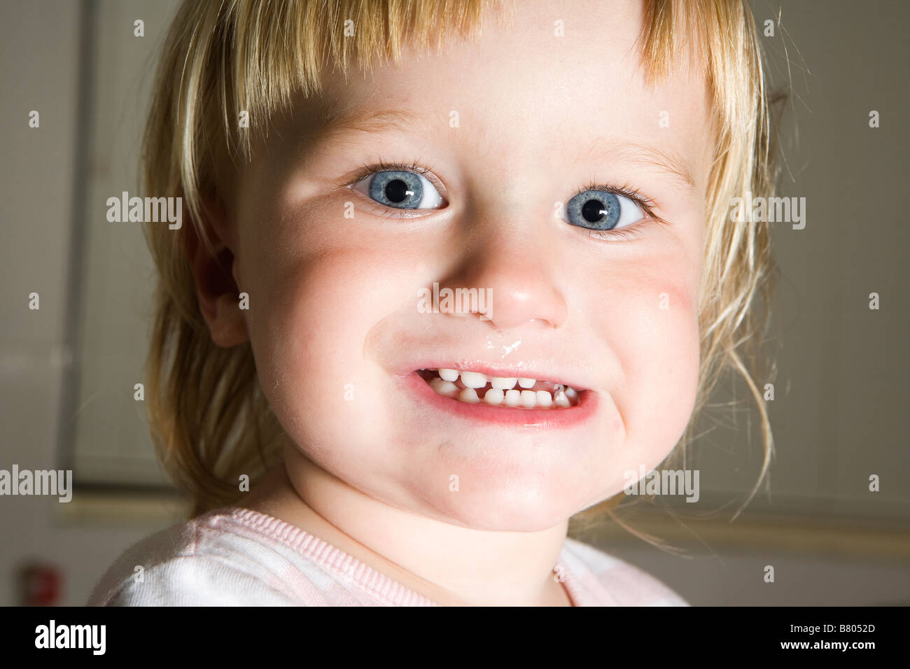 Child girl smiling showing new teeth Stock Photo - Alamy