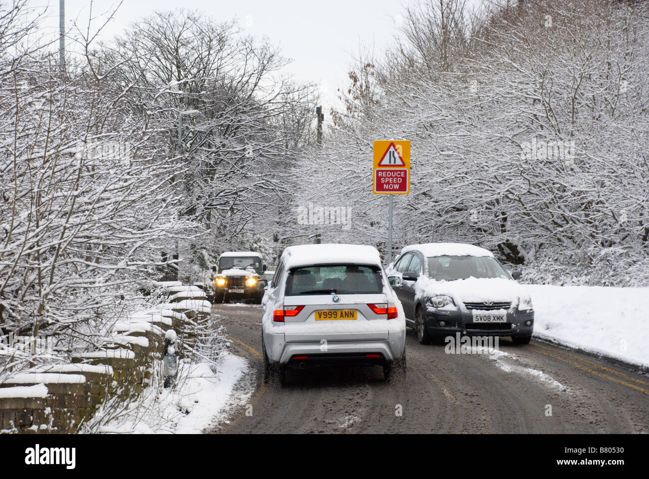 cars on a snowy winter road Stock Photo - Alamy
