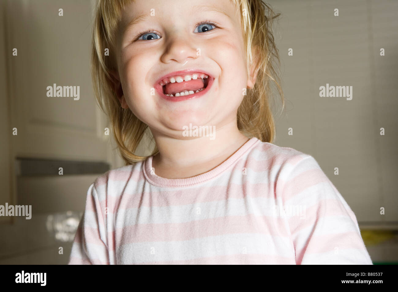 Child girl smiling showing new teeth Stock Photo - Alamy