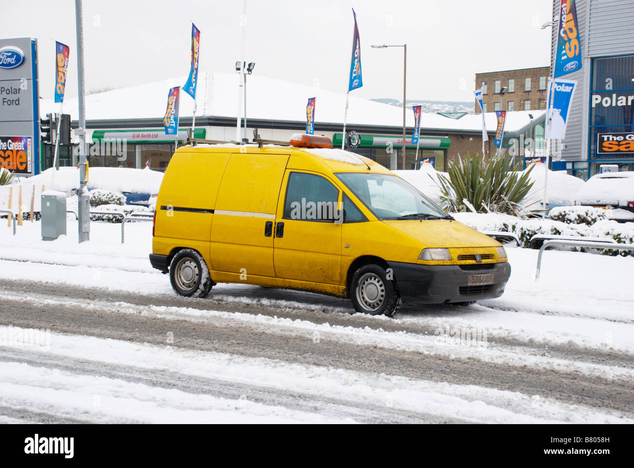 yellow van in the snow Stock Photo - Alamy