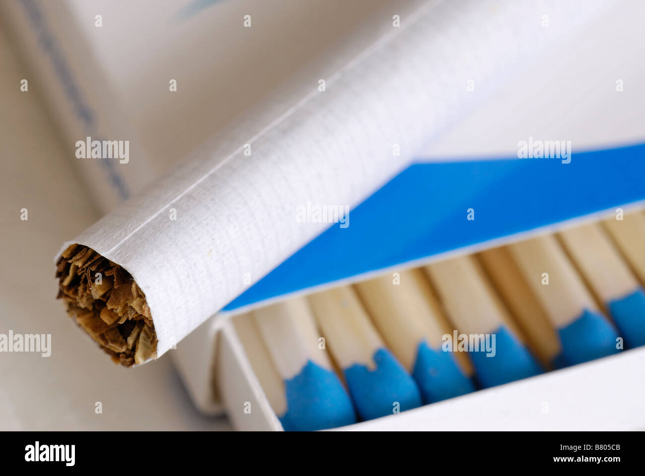Close up of the blue safety matches in white cardboard box and a ...