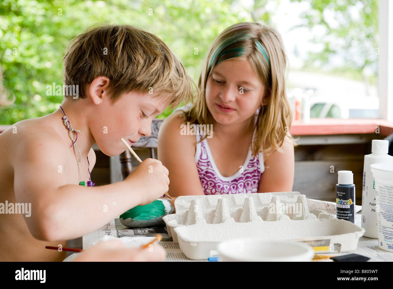 Brother and sister playing arts and crafts Stock Photo - Alamy