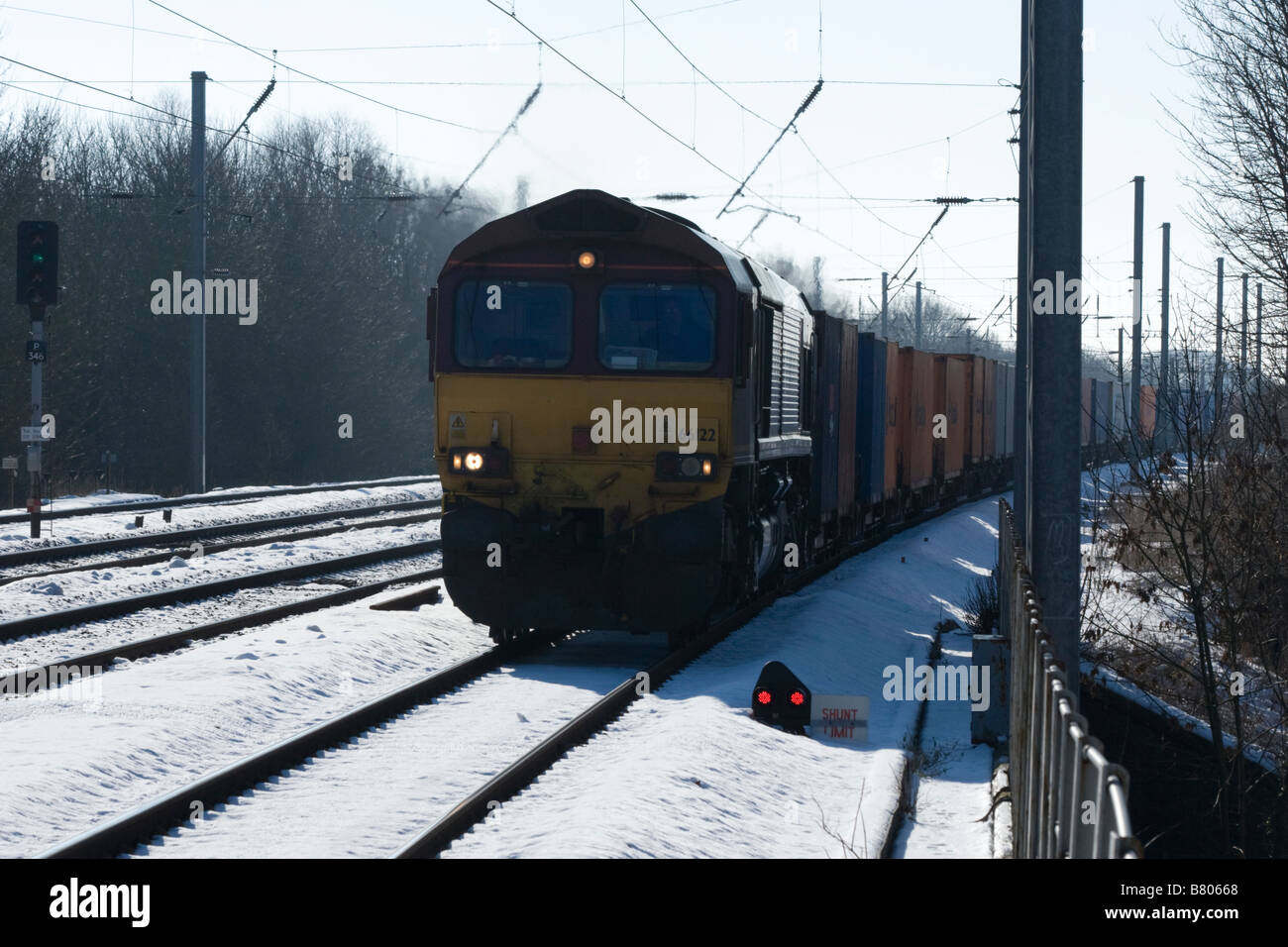 EWS Class 66 Freight Locomotive heads a container train through ...
