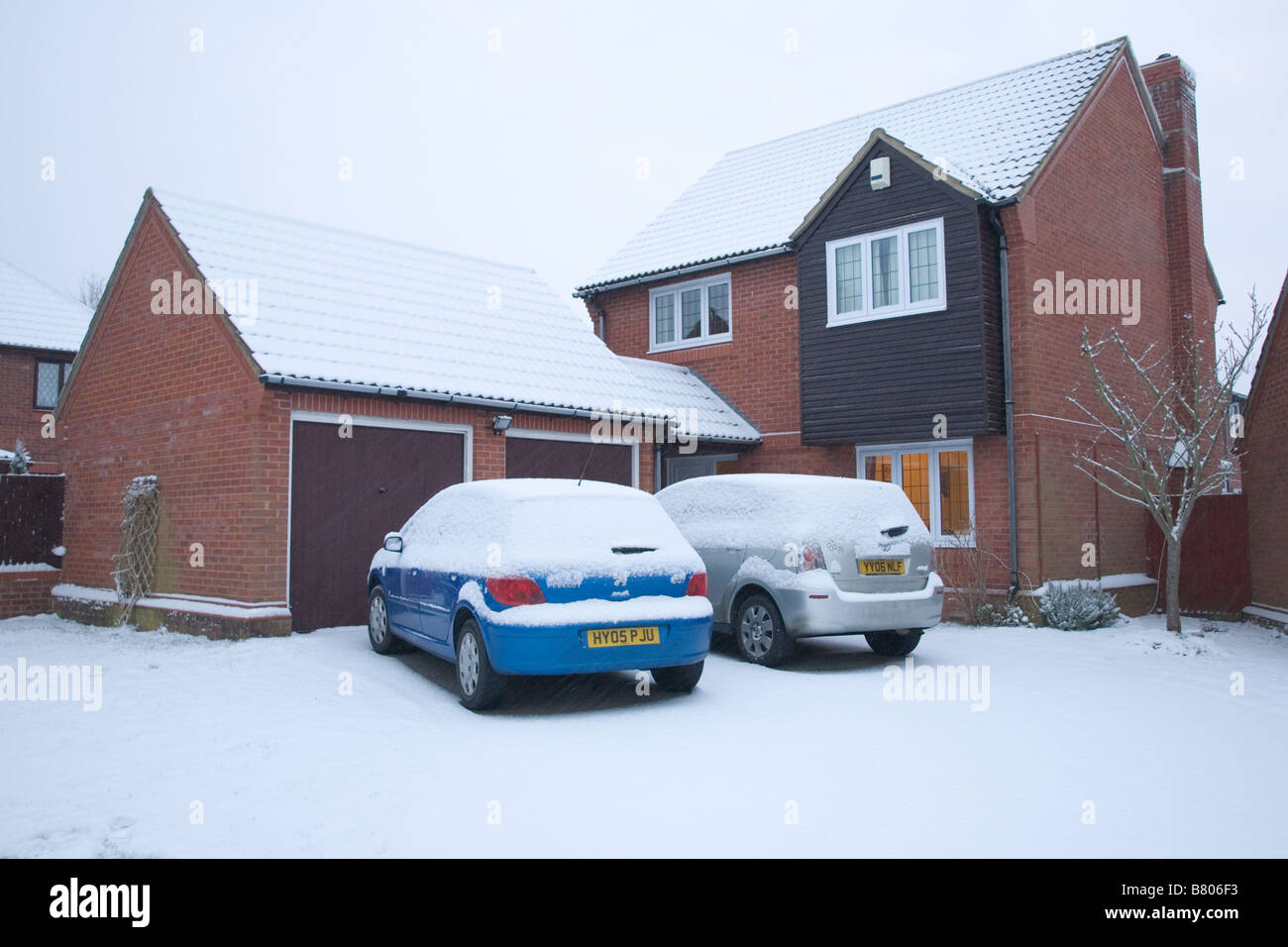 House and cars covered in snow Stock Photo - Alamy