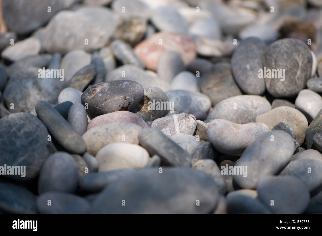 Stone beach at chios island Stock Photo - Alamy