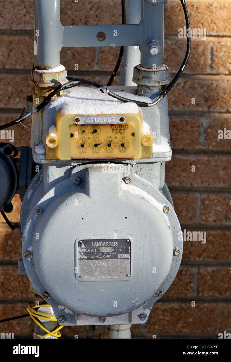 A natural gas meter sits next to a residential home. Oklahoma City ...