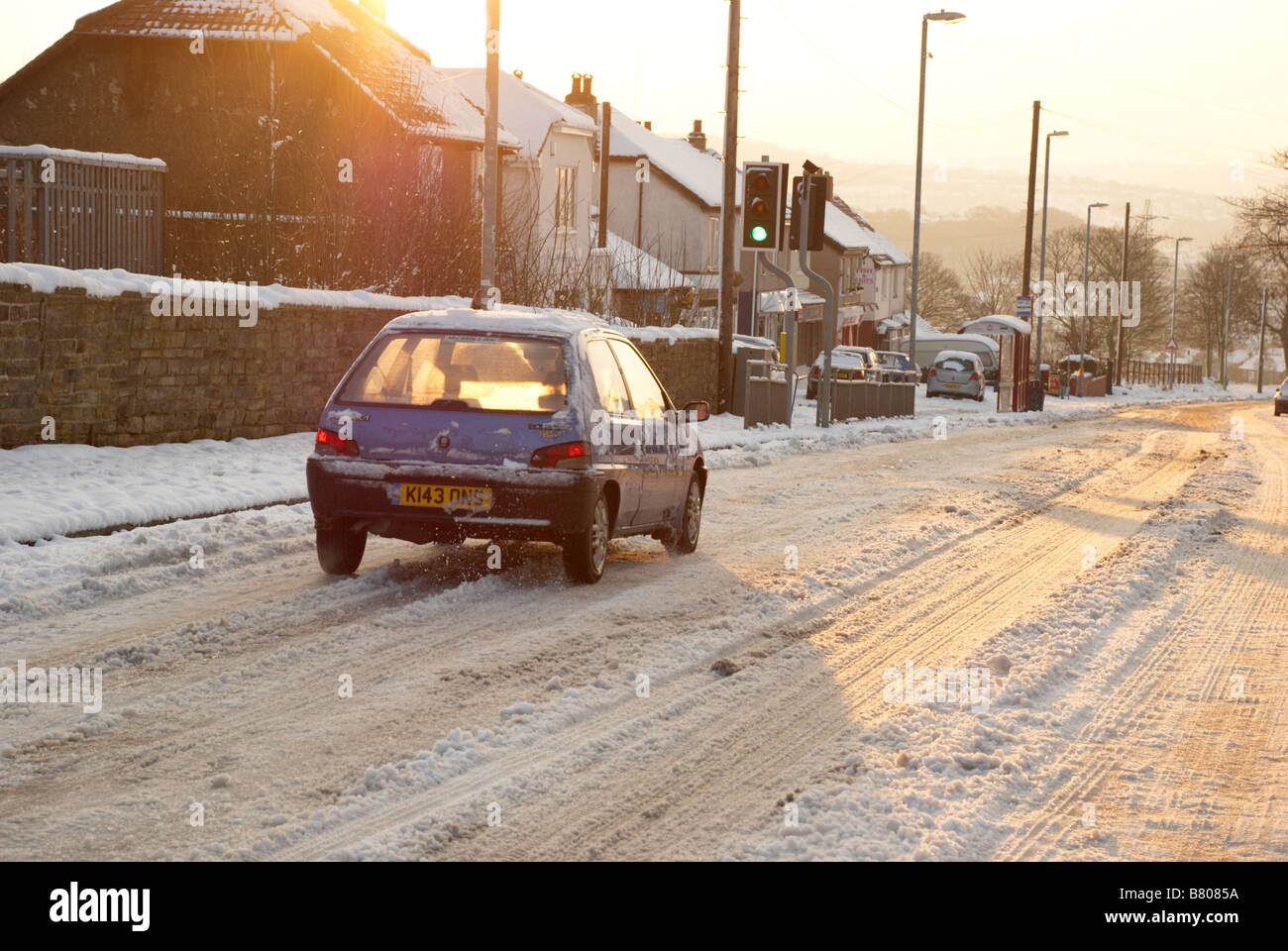 car on a snow covered road Stock Photo - Alamy