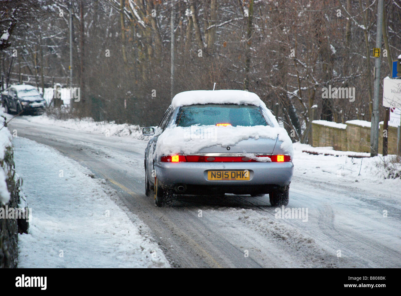 Car driving down icy road hi-res stock photography and images - Alamy