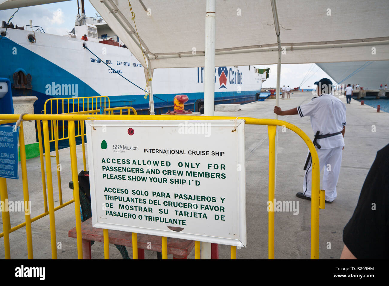 Guard behind International Cruise Ship sign restricting access to ship ... Guard behind International Cruise Ship sign restricting access to ship ...