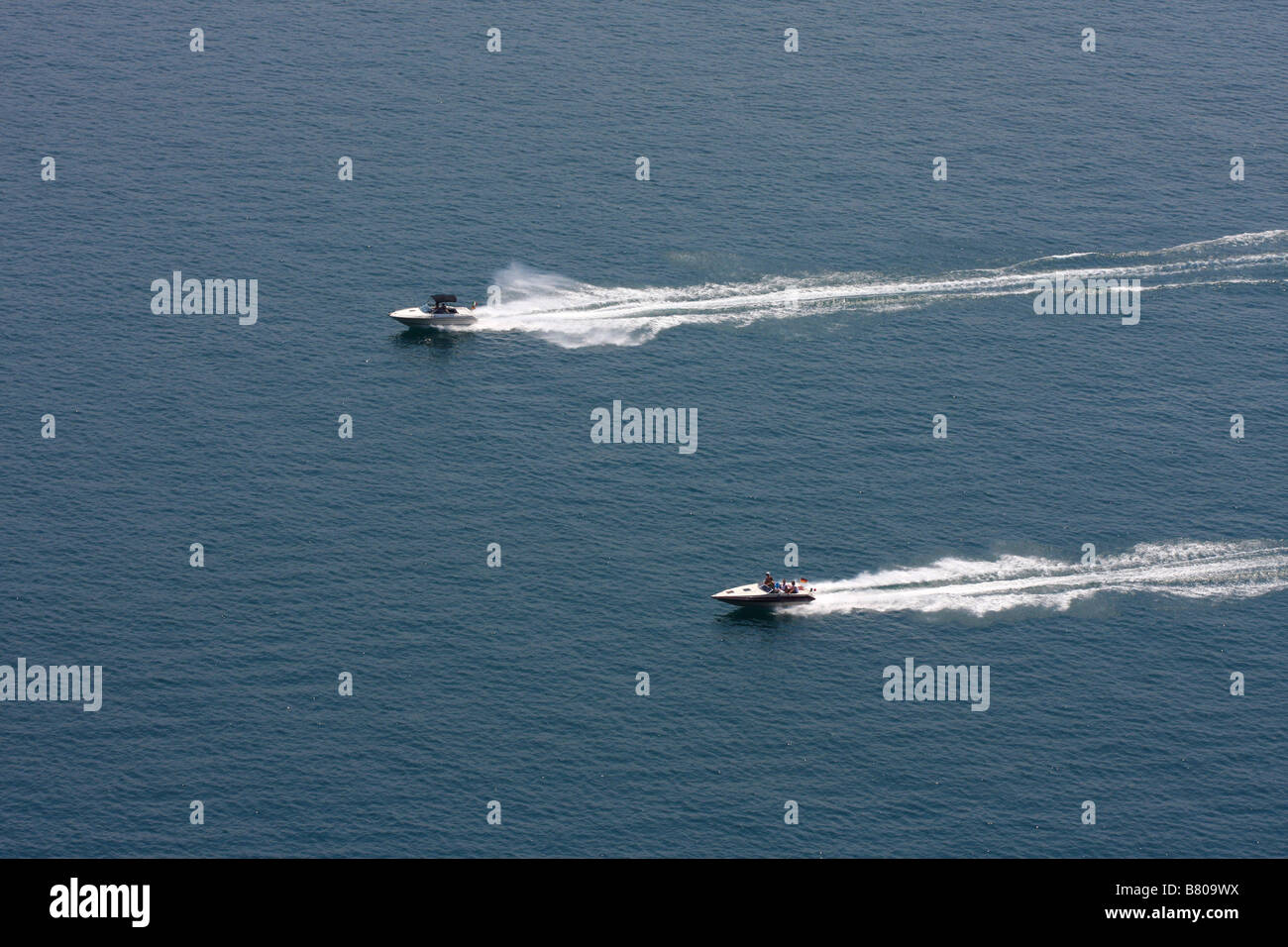 Two speedboats racing along the water Stock Photo - Alamy