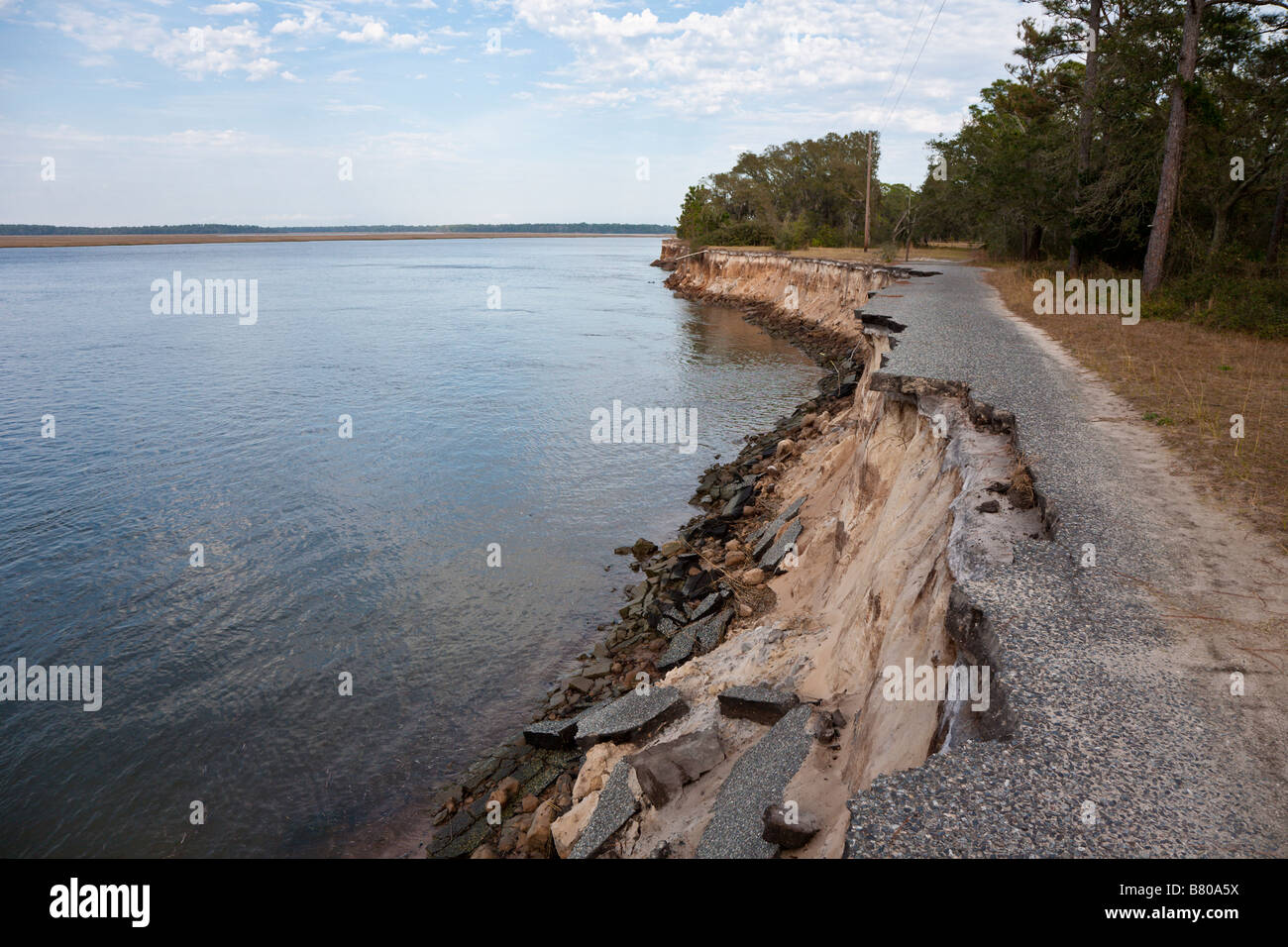Road washed away by coastal soil erosion along Crooked River coastline ...