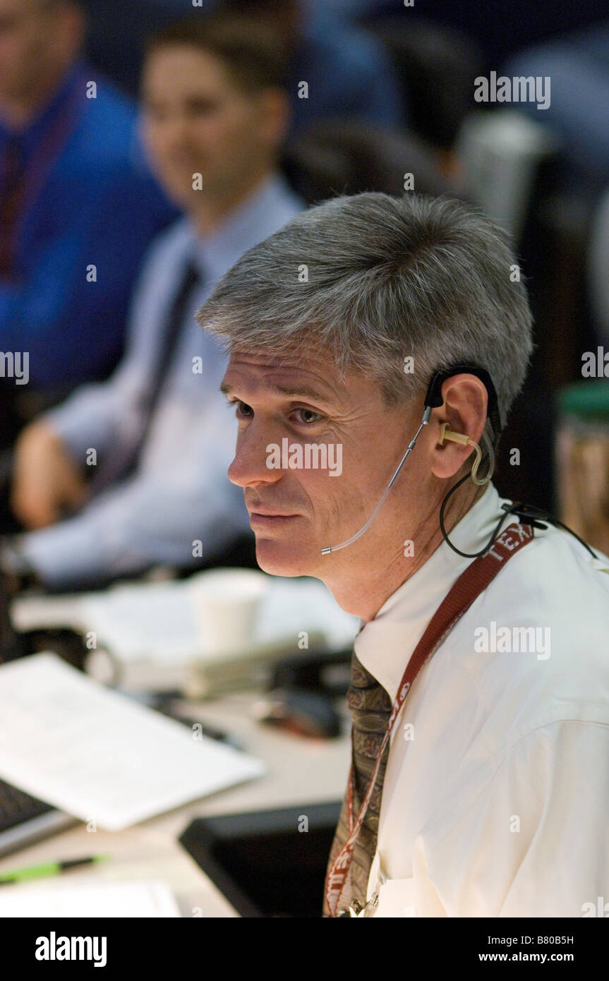 Space Shuttle flight director Bryan Lunney at mission control center ...
