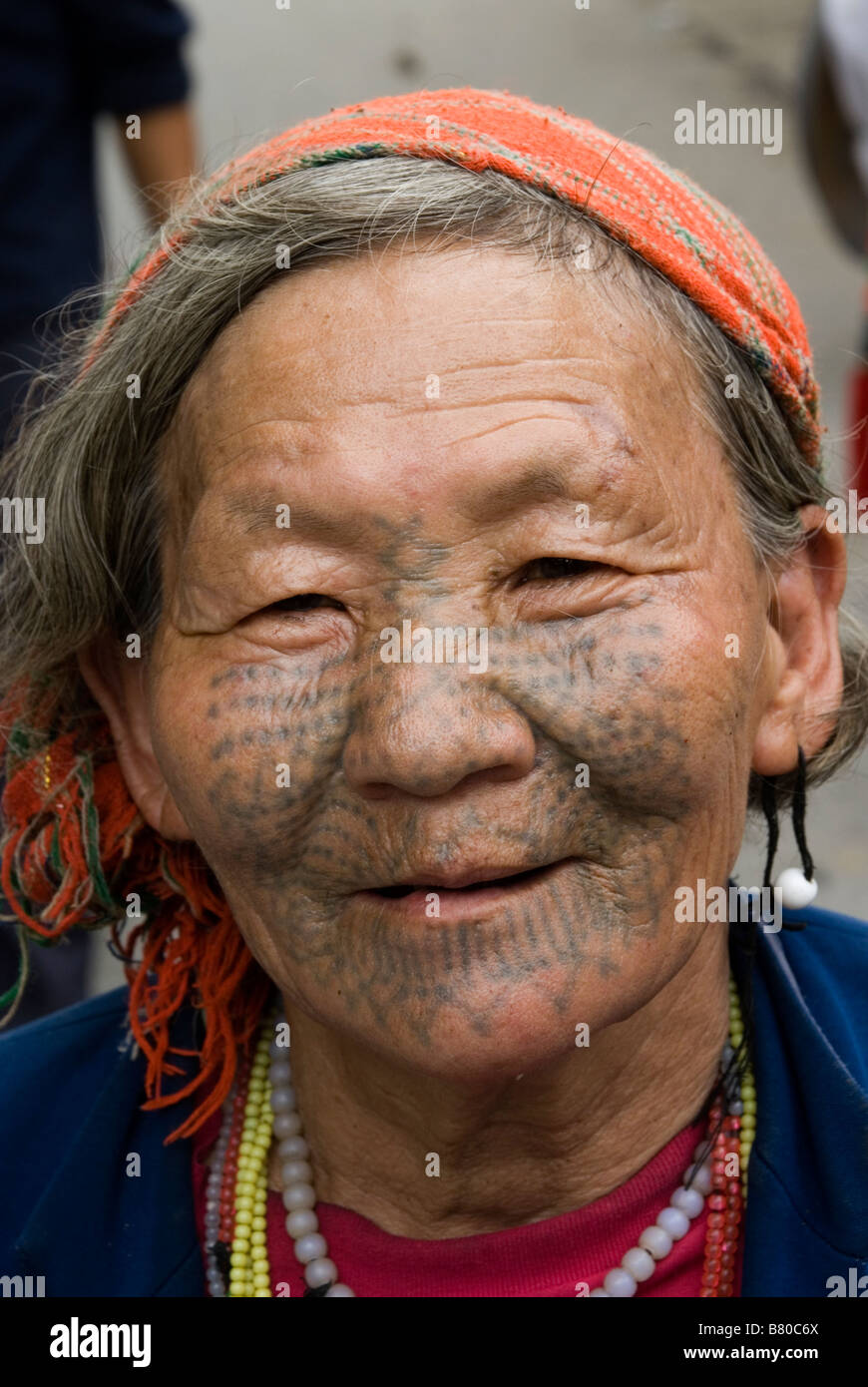 Old lady from Dulong minority people with traditional face tattoos ...