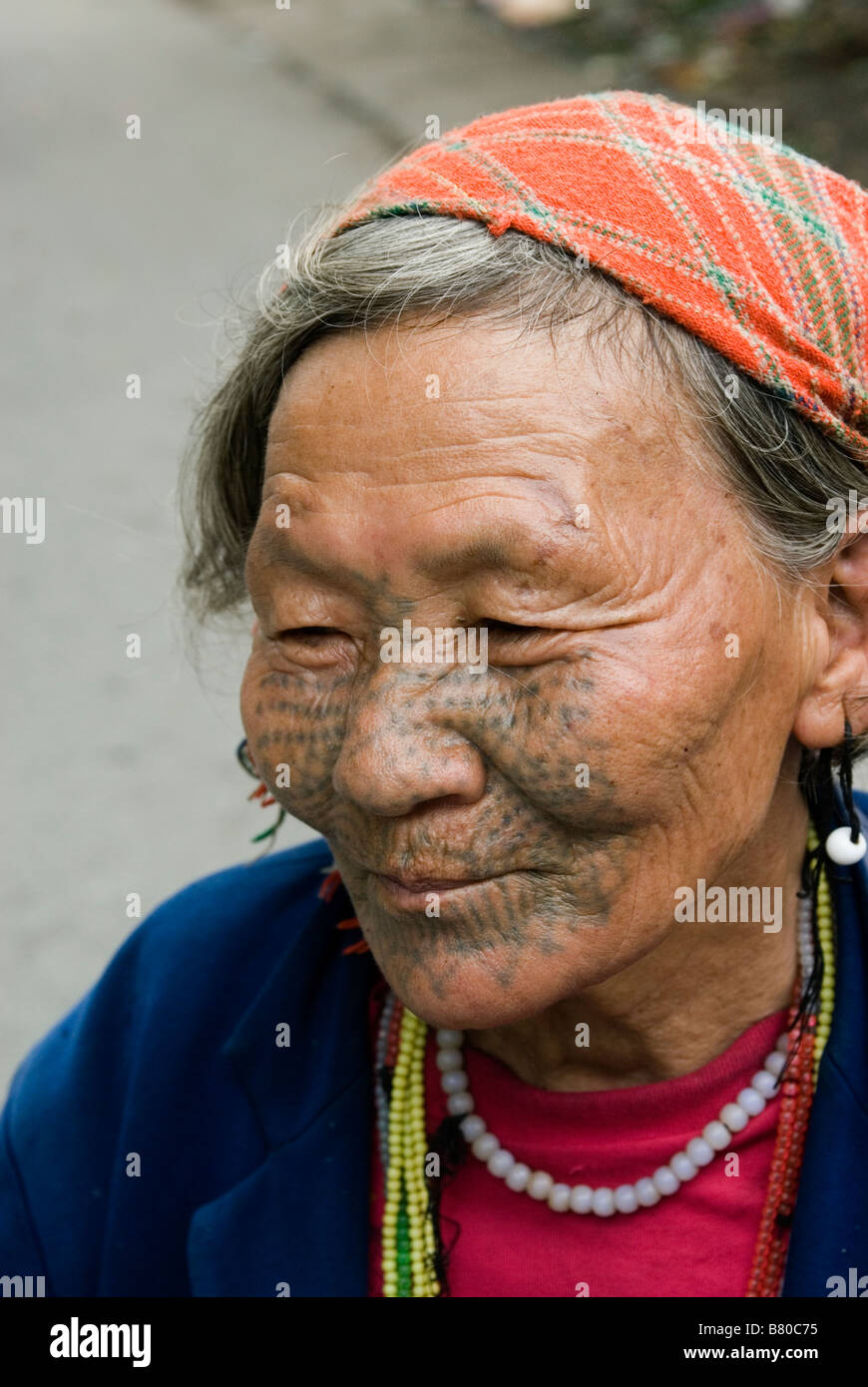Old lady from Dulong minority people with traditional face tattoos ...