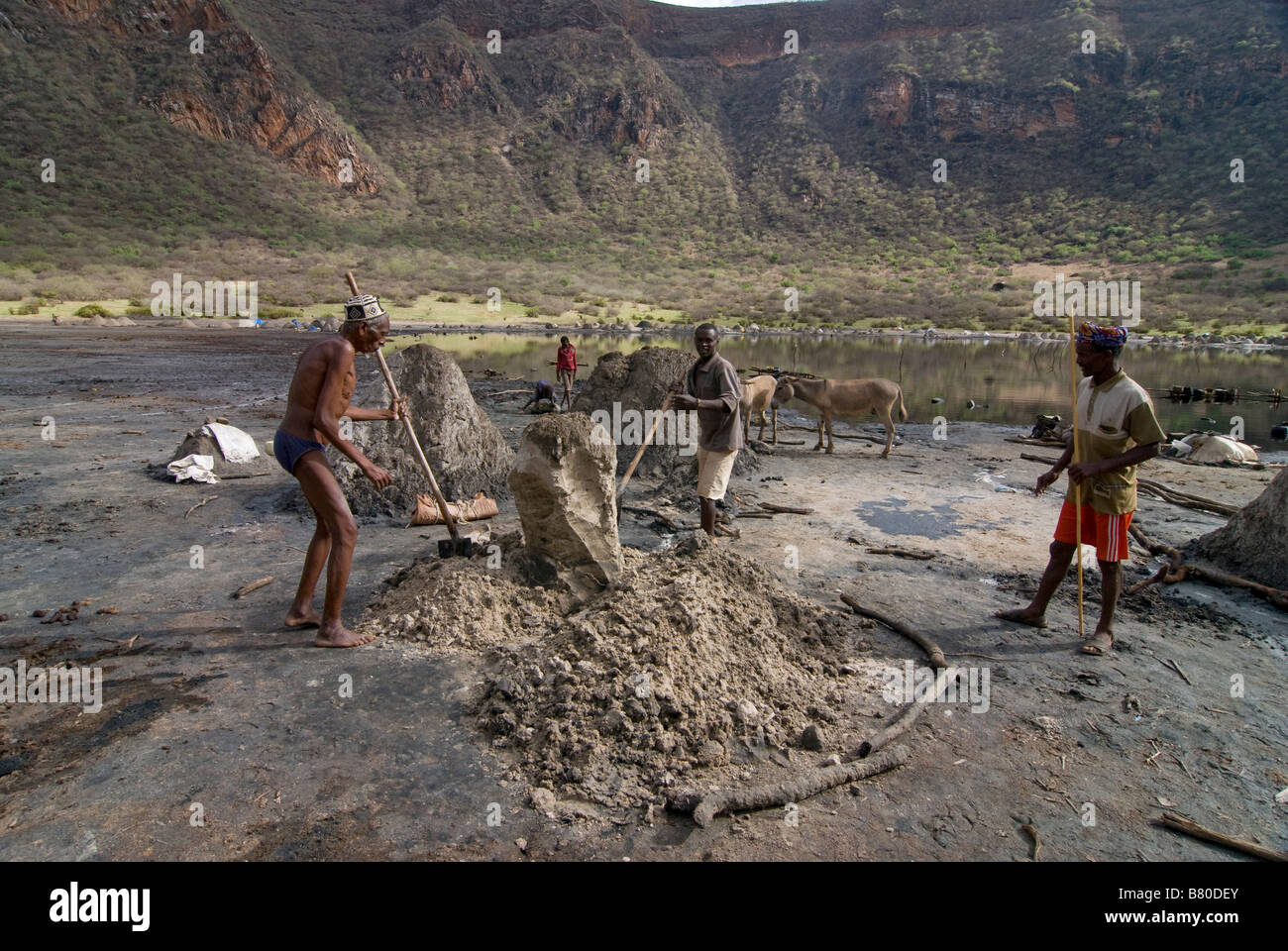 Men digging after salt Chew Bet Soda Crater Southern Ethiopia Africa ...