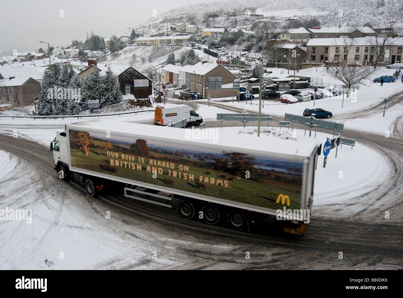 A McDonald truck making a delivery in hazardous snowy conditions Stock ...
