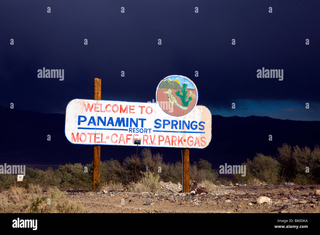 Welcome sign to Panamint Springs with dark storm clouds in the ...