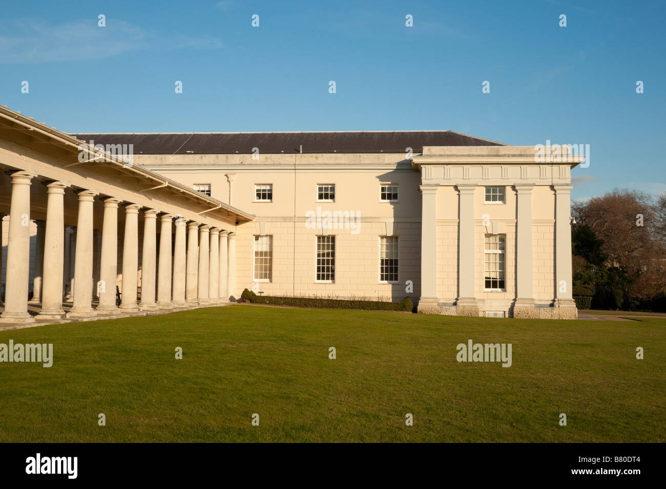 Classical building with colonnade against clear blue sky Stock Photo ...
