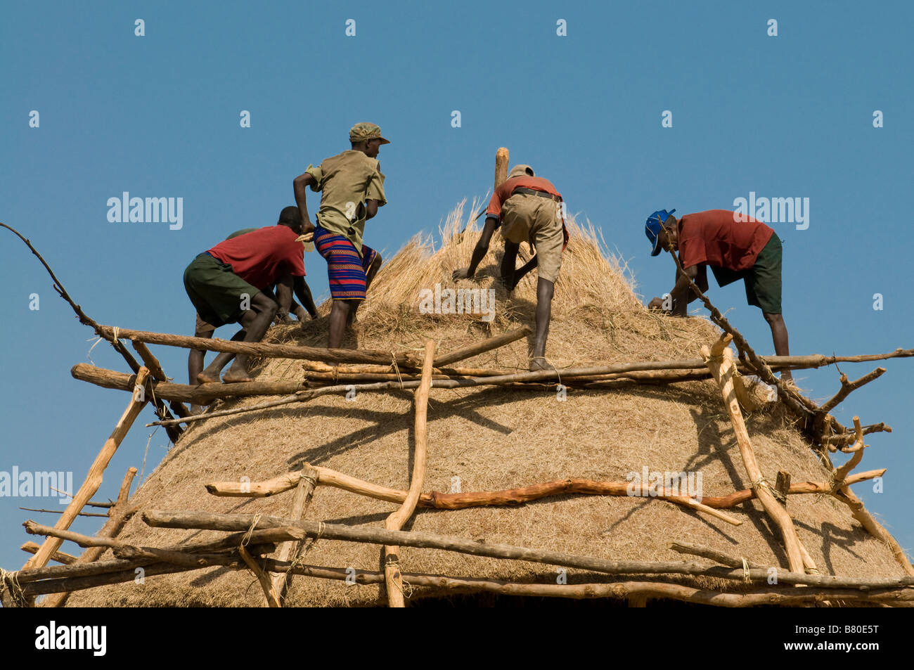 Workers working on the roof of Gezahegne Woldu s Compund a holy kraal ...