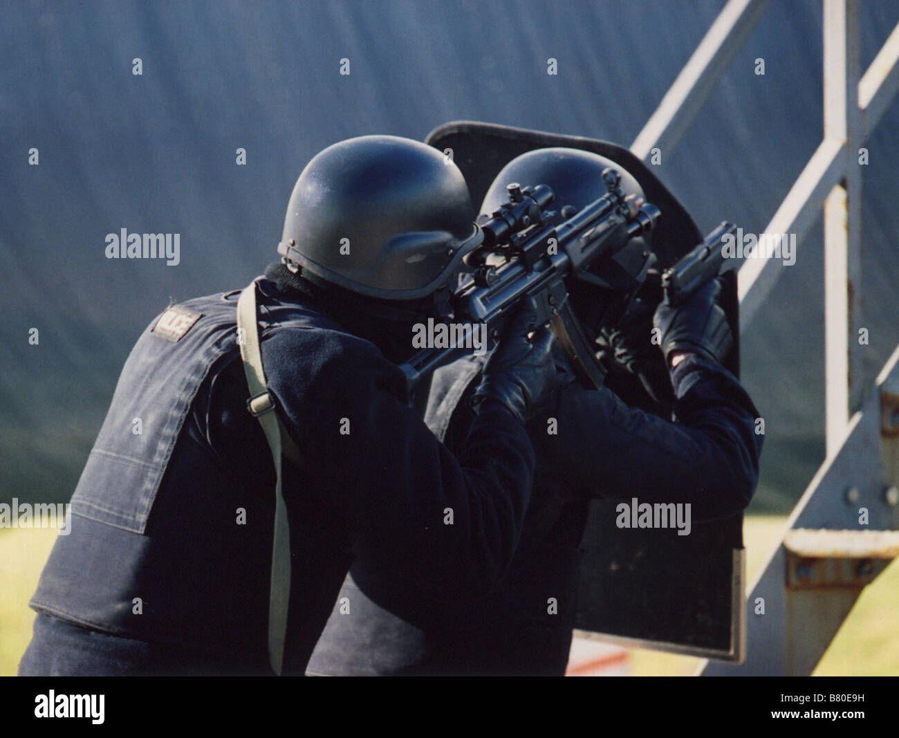 Police Firearms Officers with MP5 approaching aircraft steps Stock ...