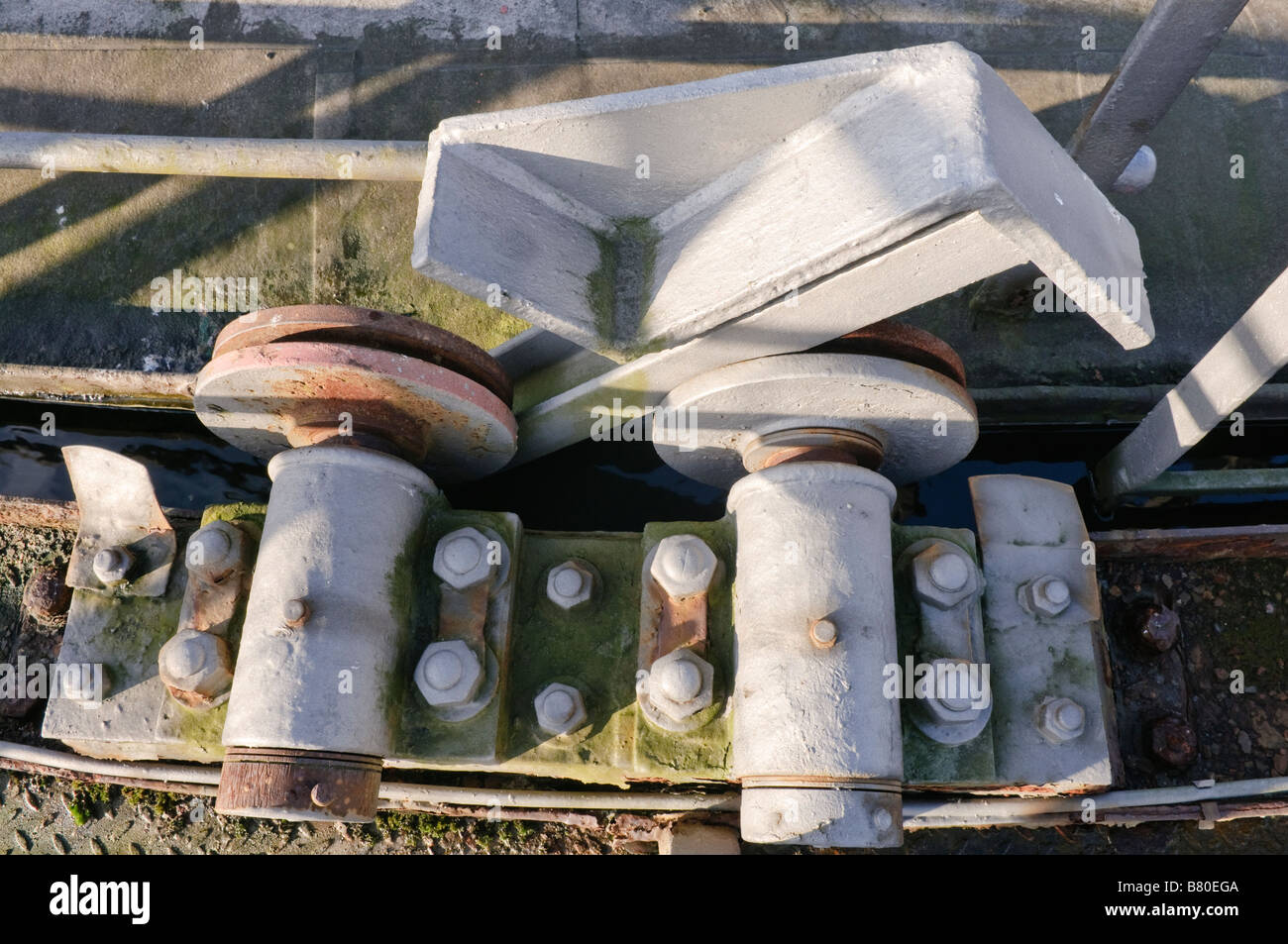 Roller/riser mechanism at top of gas tower Stock Photo - Alamy