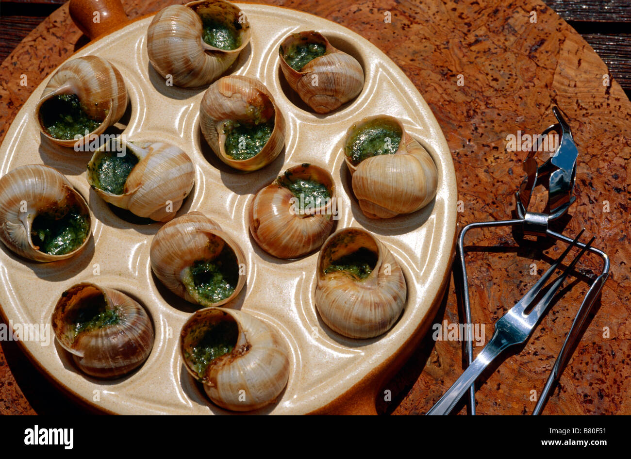 France, Southwest. Escargots a la Bourgignonne. Snails with melted ...
