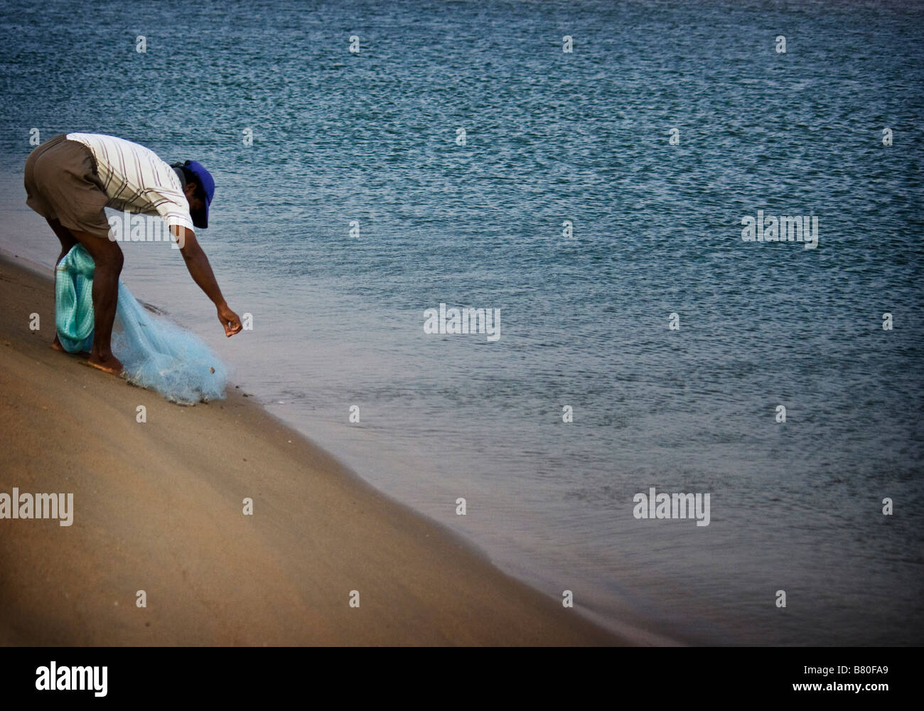 Man fishing in Goa India Stock Photo - Alamy