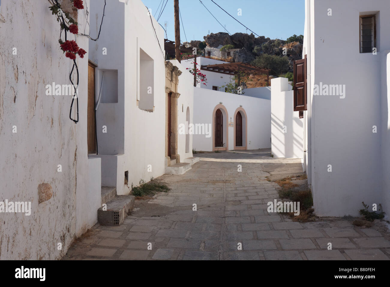 The winding small street of Lindos on the Greek island of Rhodes Greece ...