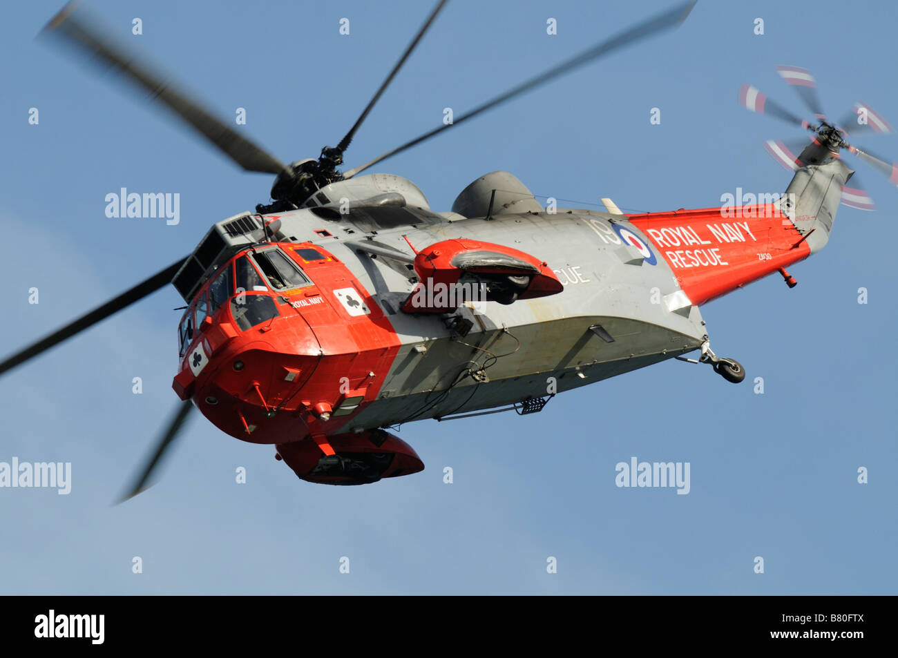 Red and grey Sea King rescue helicopter swoops down during airshow ...