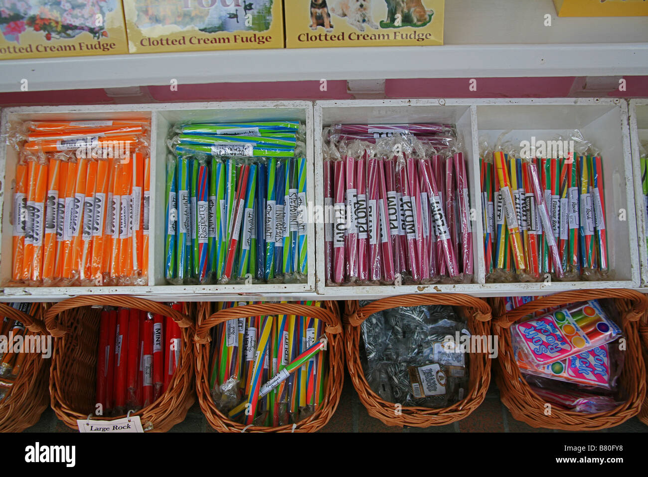Shop front display of sticks of rock in a sweet shop in Lynmouth, North ...