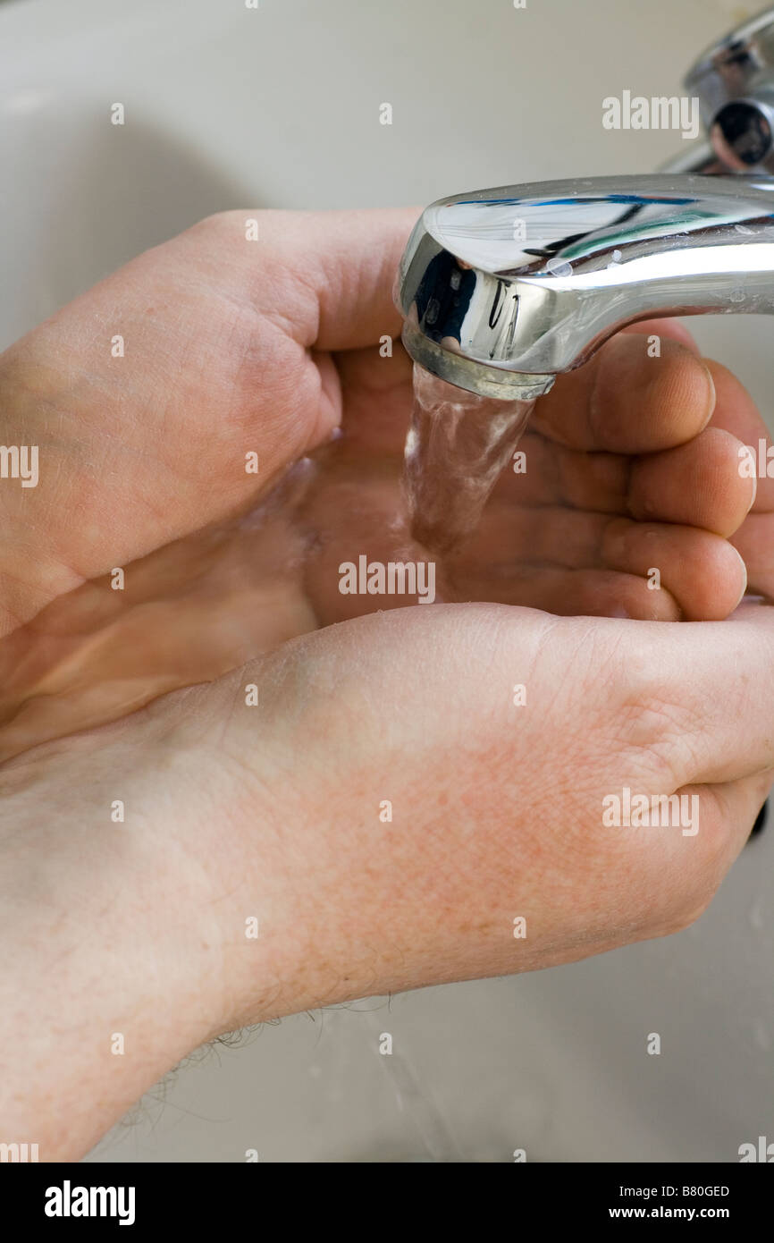 Cupping hands collect water Stock Photo - Alamy