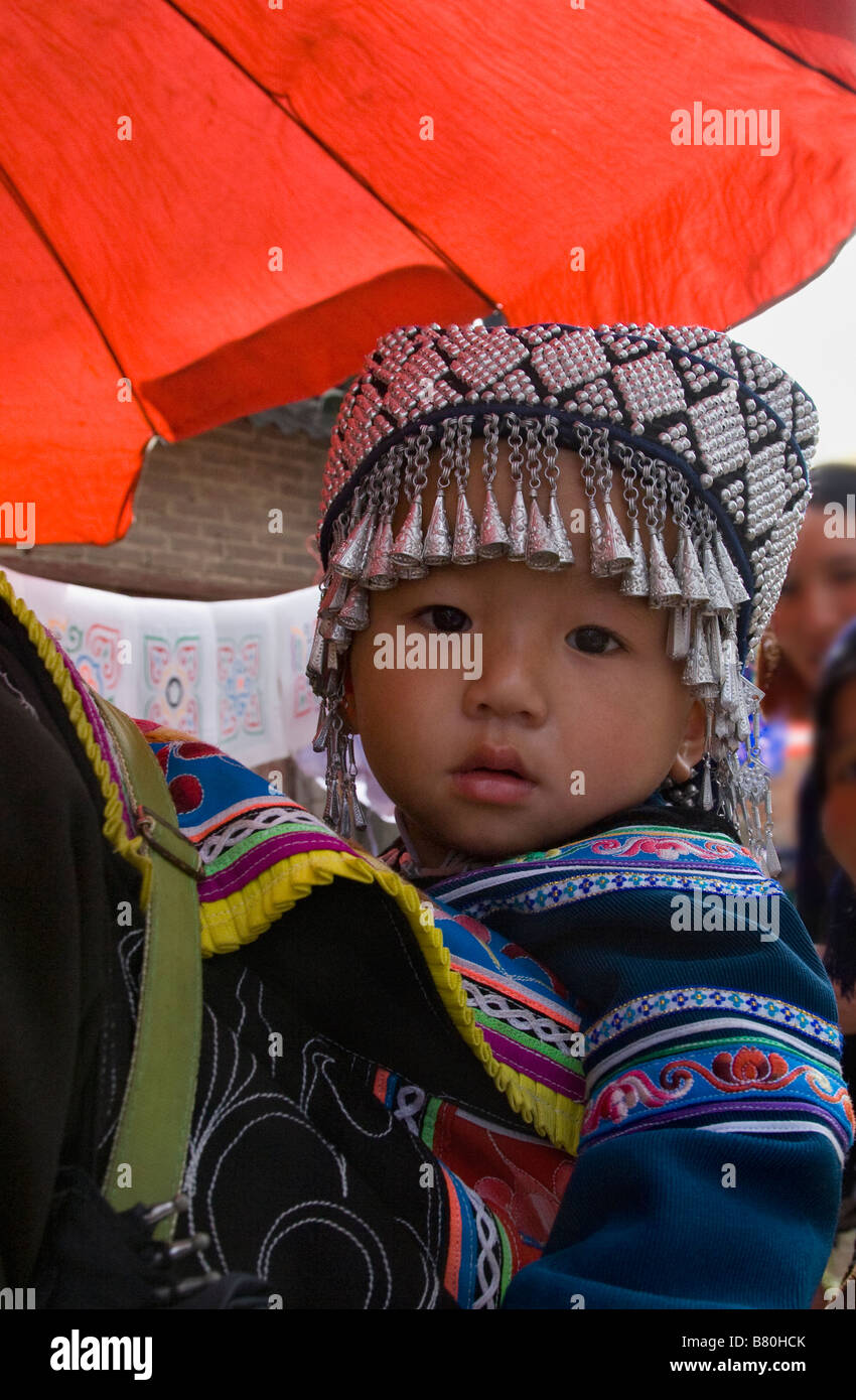 Hani girl in traditional costume at local market Yunnan Province China ...