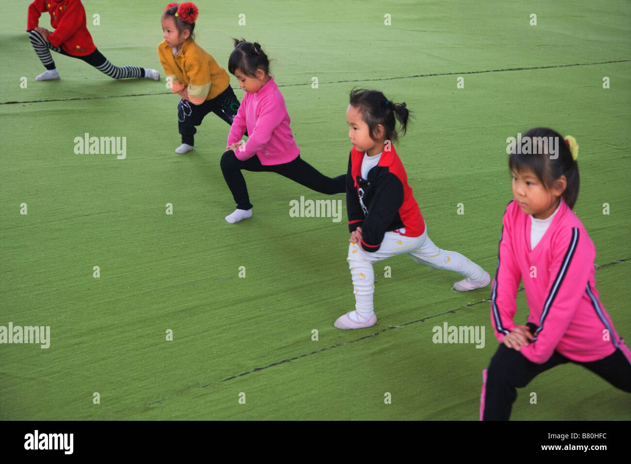 Children receiving gymnastics training China Stock Photo - Alamy