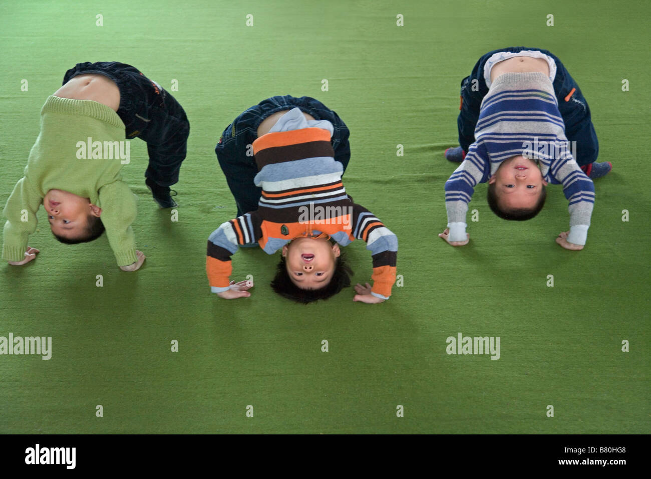 Children receiving gymnastics training China Stock Photo - Alamy