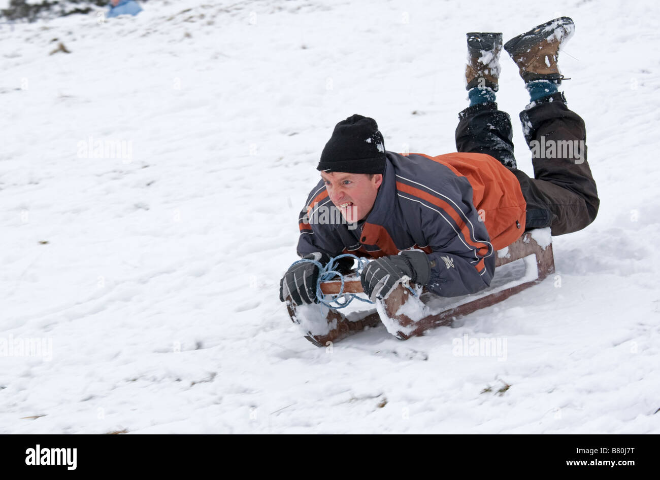 Man sledging hi-res stock photography and images - Alamy