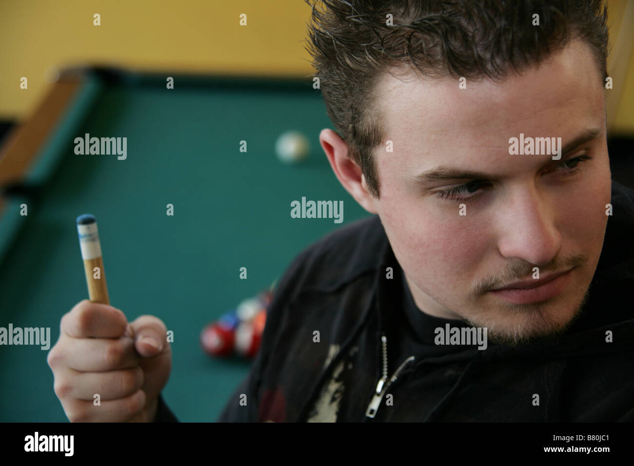 Young man ready for a challenging game of pool Stock Photo - Alamy