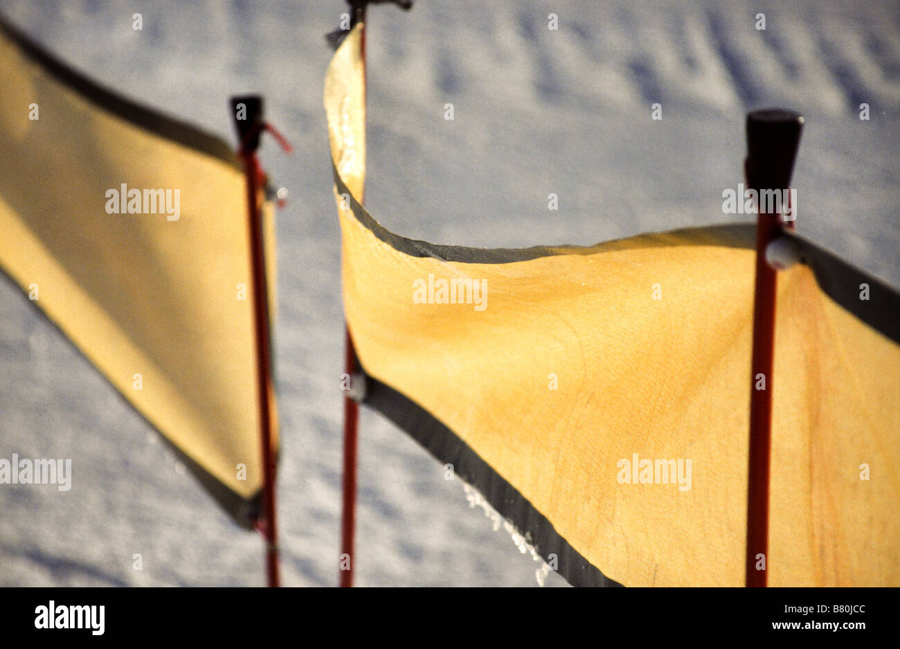 Hazard/Warning Flags on the piste in a ski resort Stock Photo - Alamy
