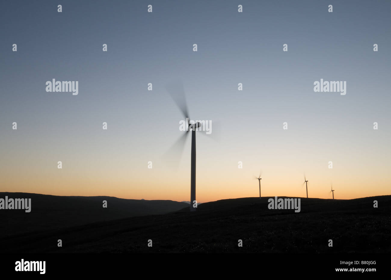 Wind powered turbines at dusk Stock Photo - Alamy