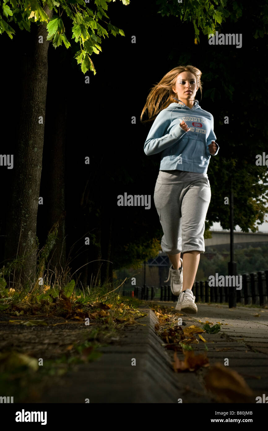 Female running in early hours of morning Stock Photo - Alamy