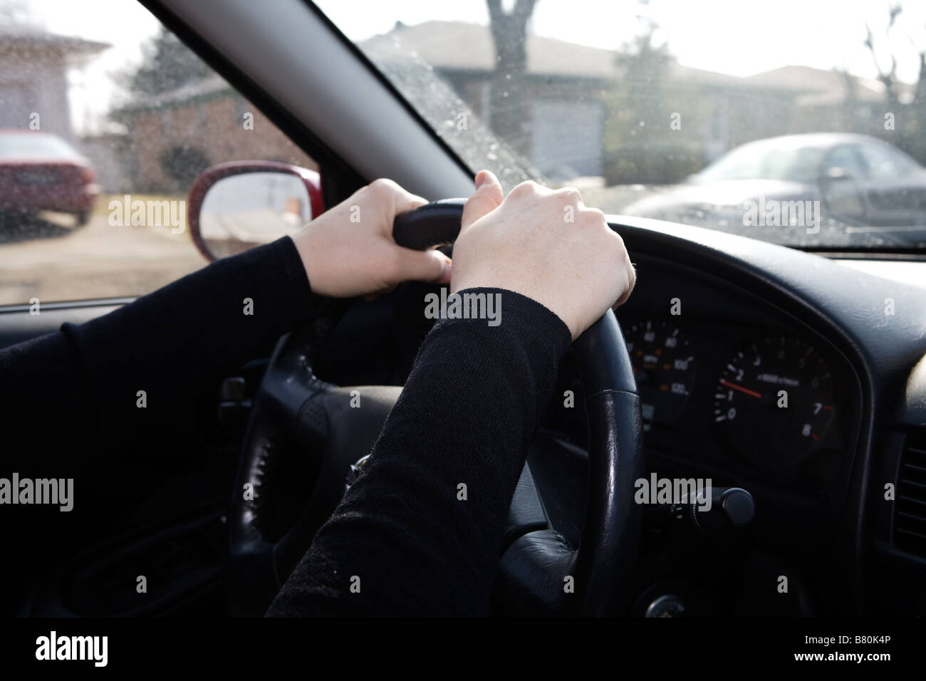 A person driving a ar Stock Photo - Alamy