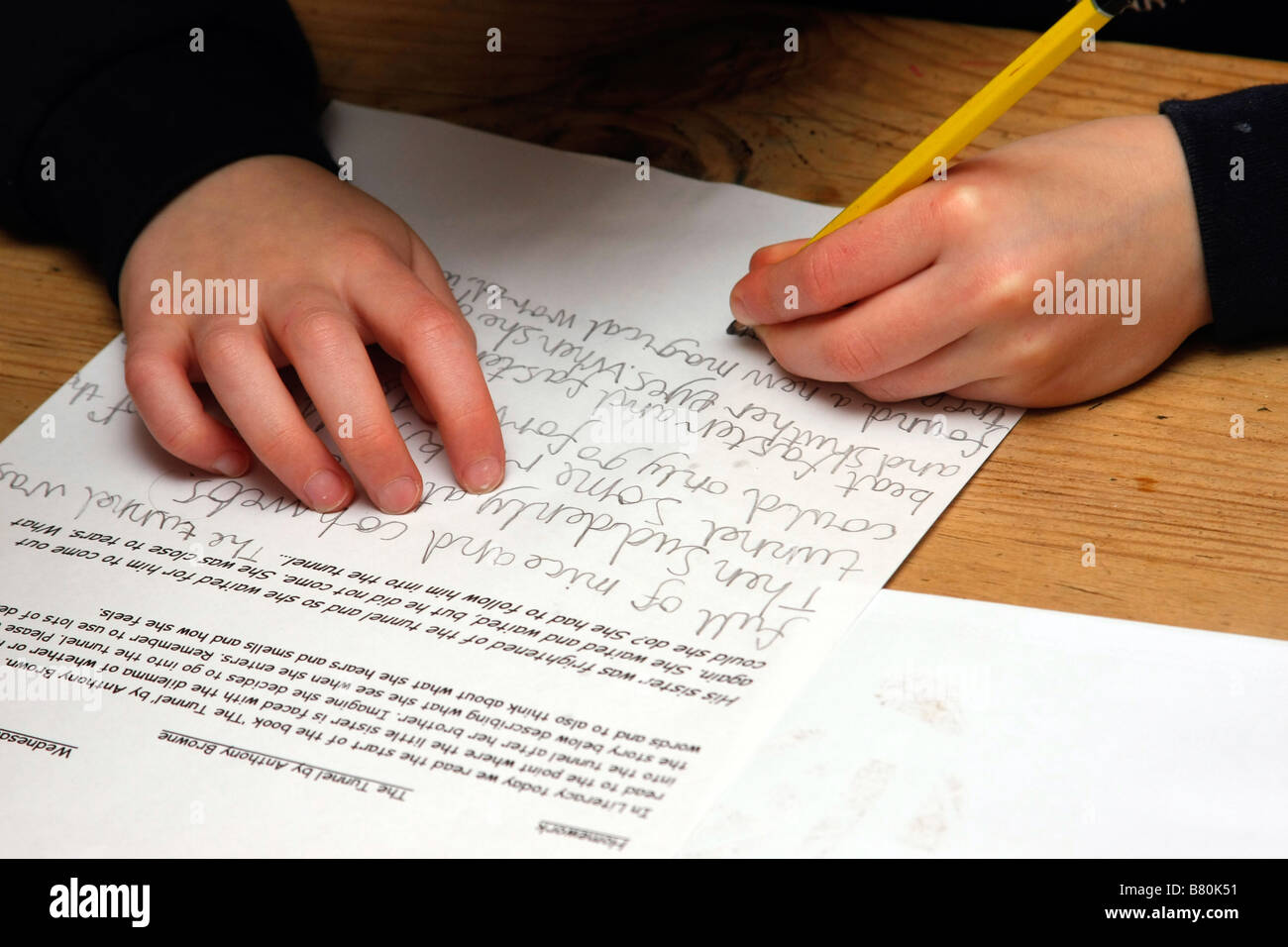 Childs hands doing school homework Stock Photo - Alamy