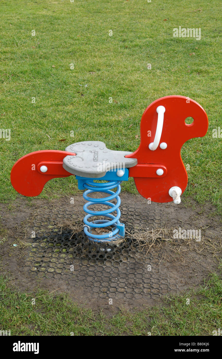 A child's riding toy in a playground Stock Photo - Alamy