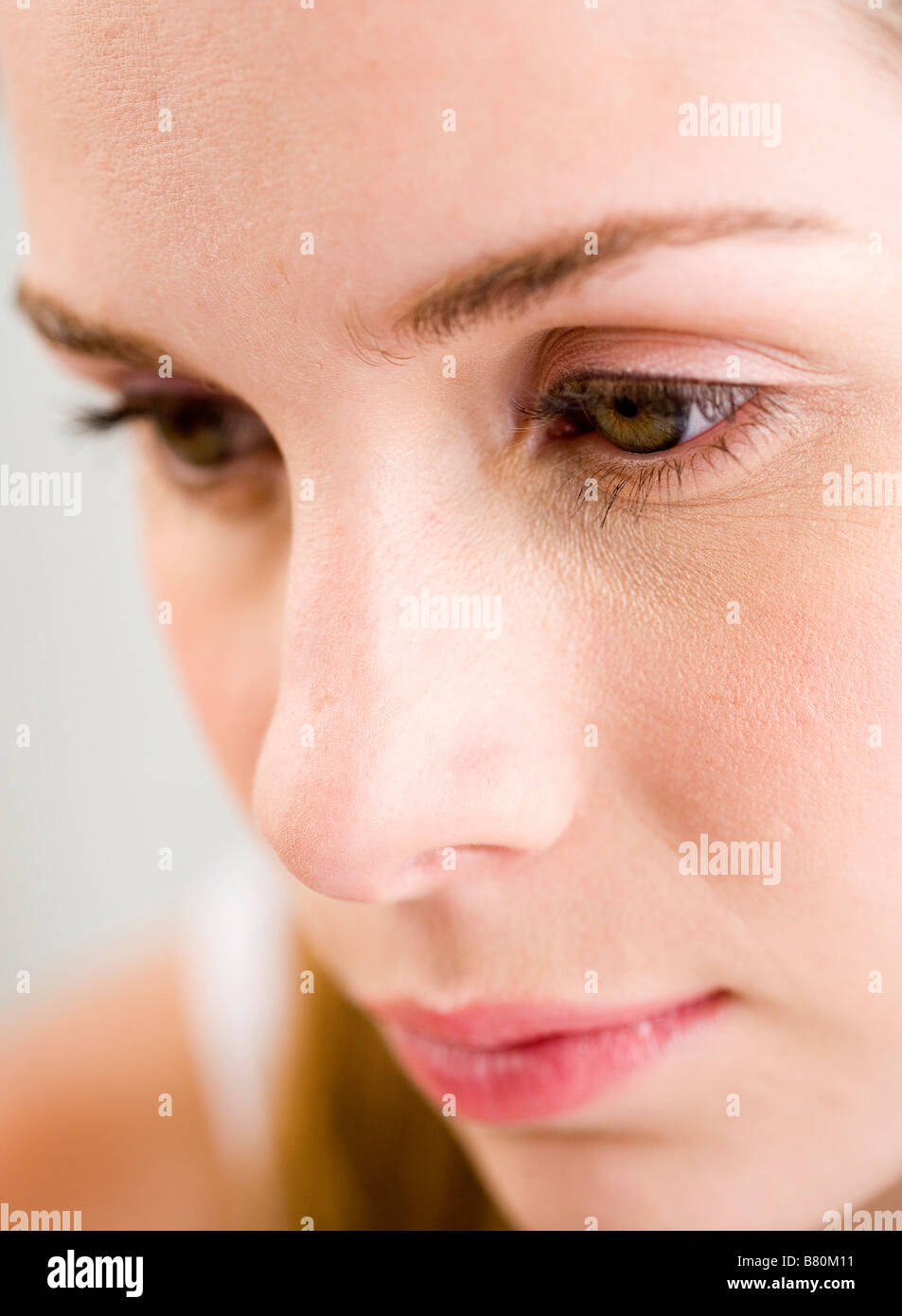 Close up to a young woman s face side view Stock Photo - Alamy