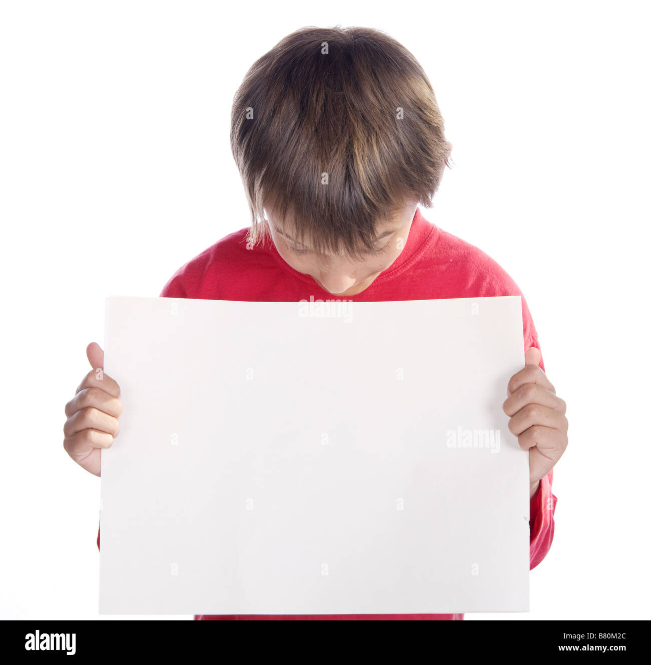 Boy holding paper white background hi-res stock photography and images ...