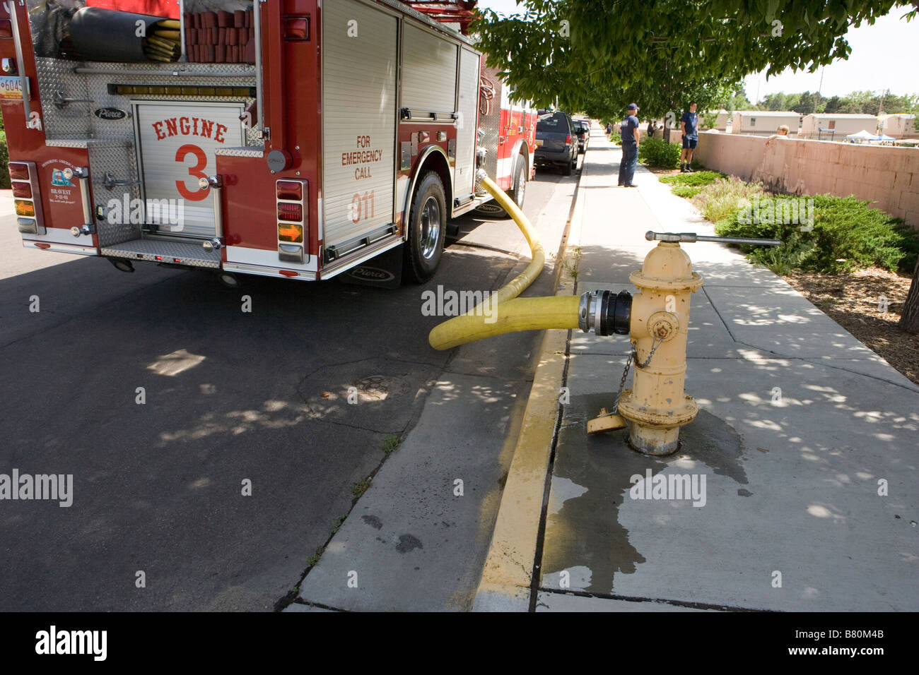 fire truck connected to fire hydrant on the street, southwestern united ...