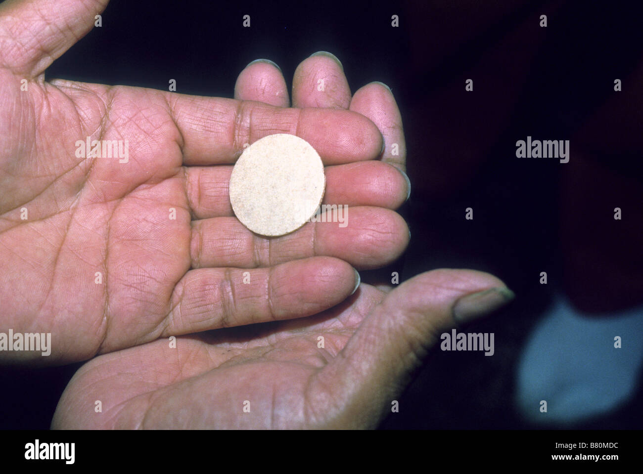 Hands hold communion wafer host during Catholic mass body Stock Photo ...